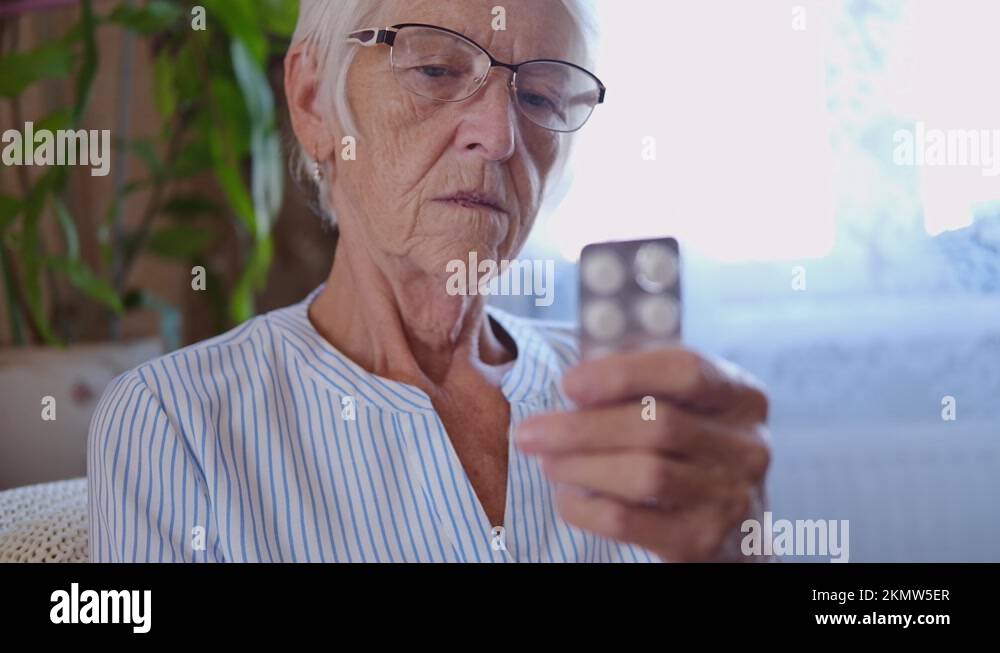 Old caucasian senior woman read drug prescription label. elderly people ...