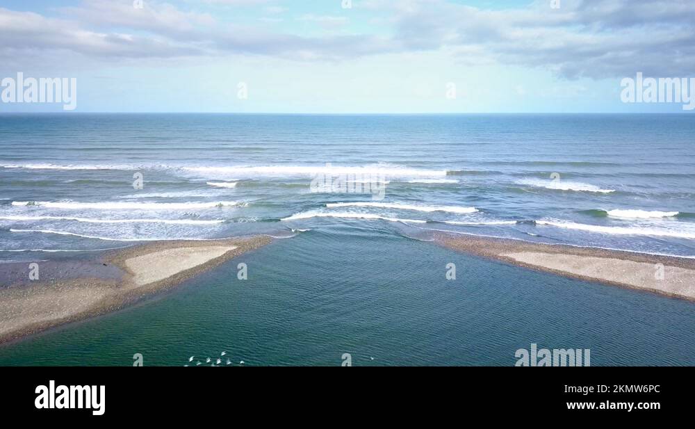 Stunning aerial where the Mokihinui River Mouth meets the Tasman Sea in ...