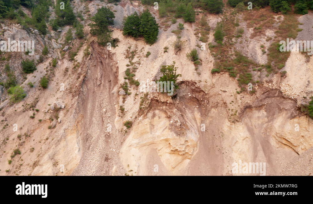 Soil erosion on a steep slope due to landslide. Surface ground movement ...