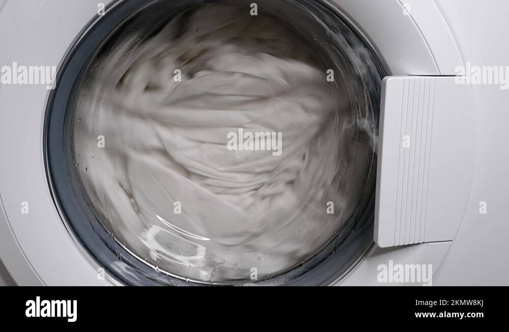 Washing clothes in a washing machine. 4k Stock Video Footage - Alamy