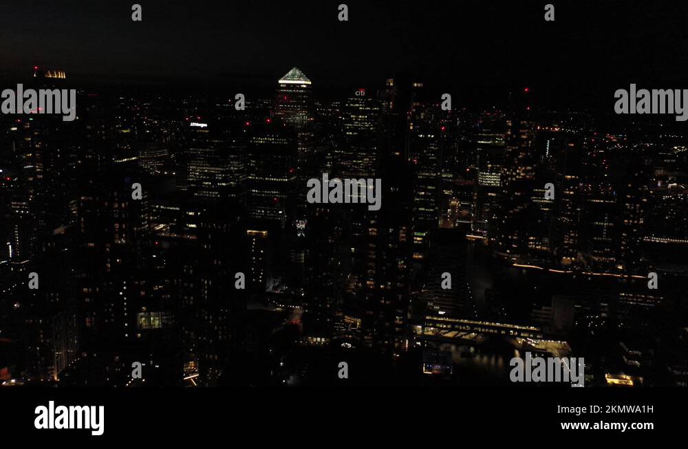 Cityscape at night, lighted windows and street lights from mid air ...