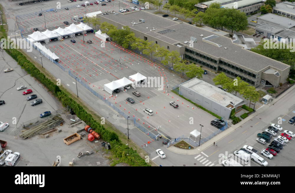 COVID-19 Vaccine Drive-Thru Facility - Vehicles Driving Through Tents ...