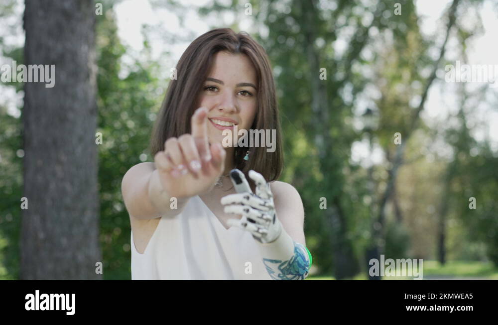 Girl with bionic hand is posing for selfie Bionics Cybernetic Robotic ...