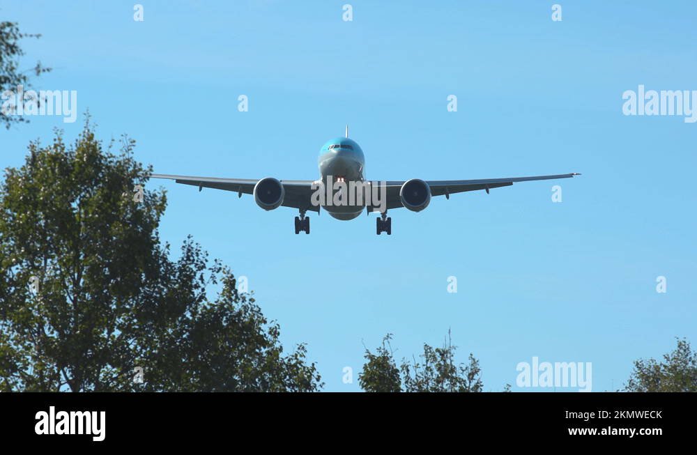 huge cargo airplane korean boeing 777F in flight slow motion front view ...