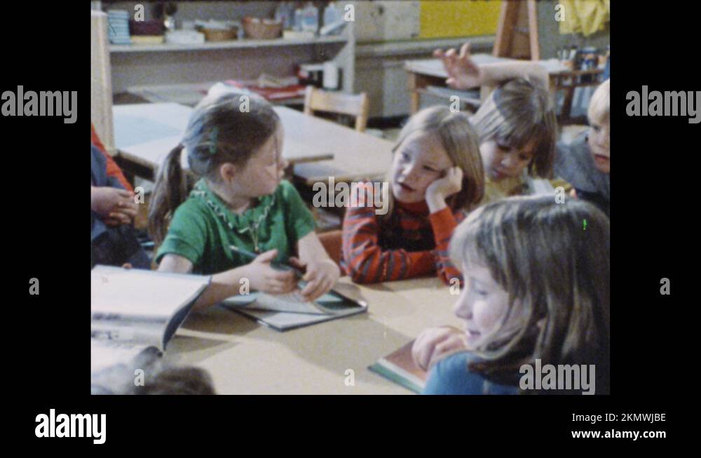 1970s: Classroom. Teacher calls on students. Students speak Stock Video ...
