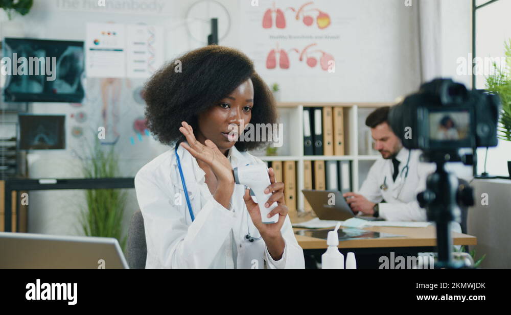 Beautiful positive qualified smart black-skinned female doctor ...