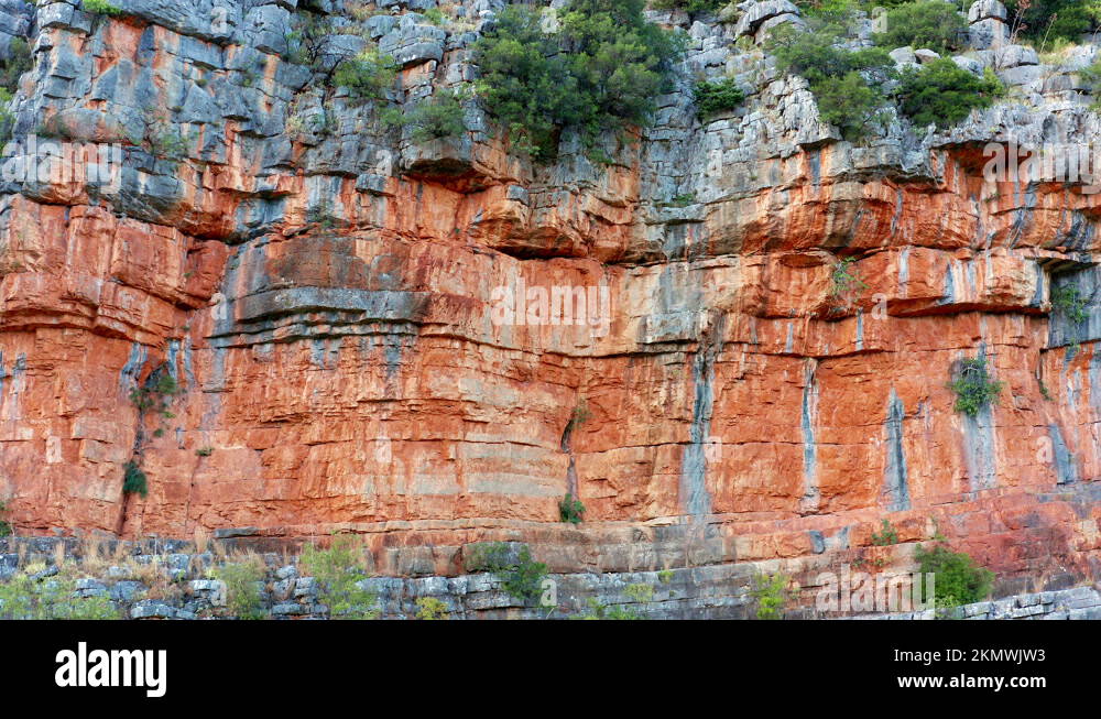 Red rugged cliff sedimentary rock Stock Videos & Footage - HD and 4K ...