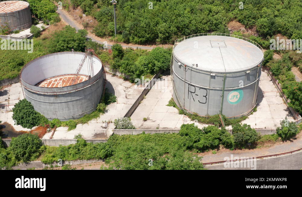 Tanks in oil terminal depot in industrial facility with cylindrical ...