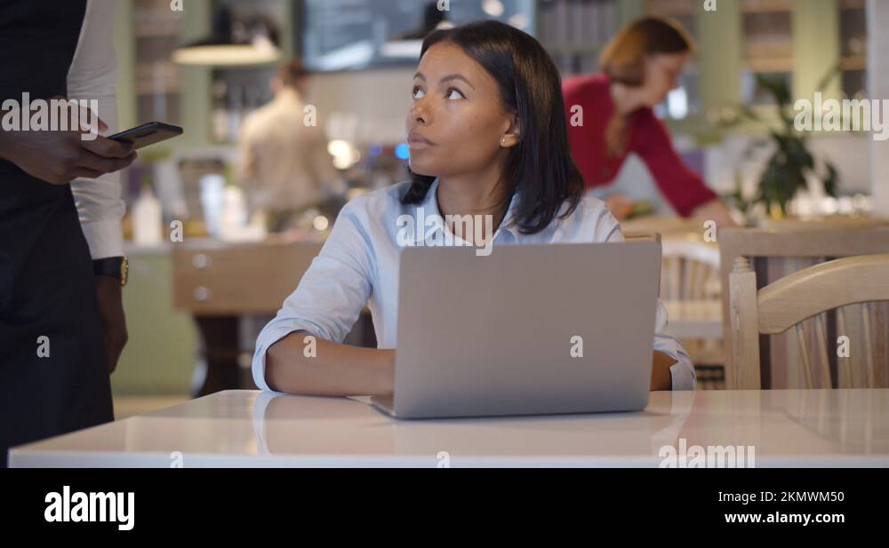 Waiter with smartphone scan qr-code on customer screen for contactless ...