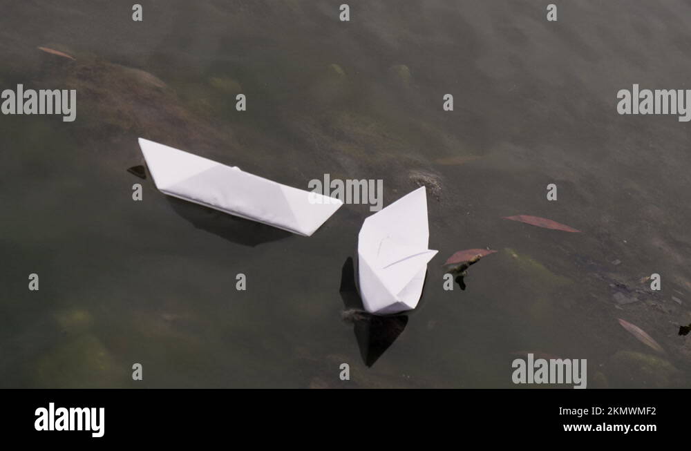 Paper boat creative Stock Videos & Footage - HD and 4K Video Clips - Alamy
