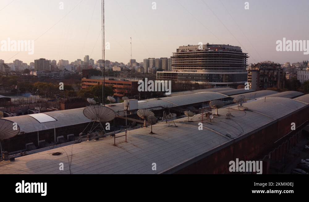 5G rooftop base station covered with telecom tower antenna producing ...