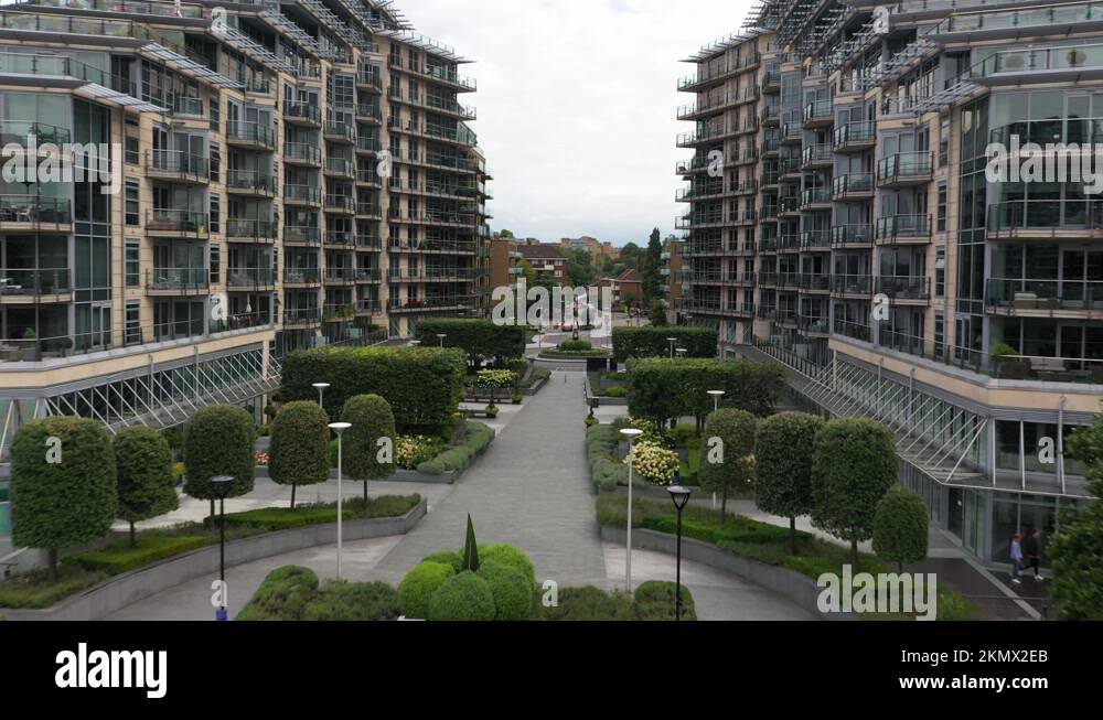 Walkway and zones with greenery between tall apartment buildings Stock ...