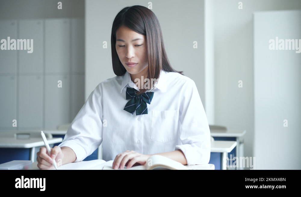 Girls high school students who look out of the window during classroom ...