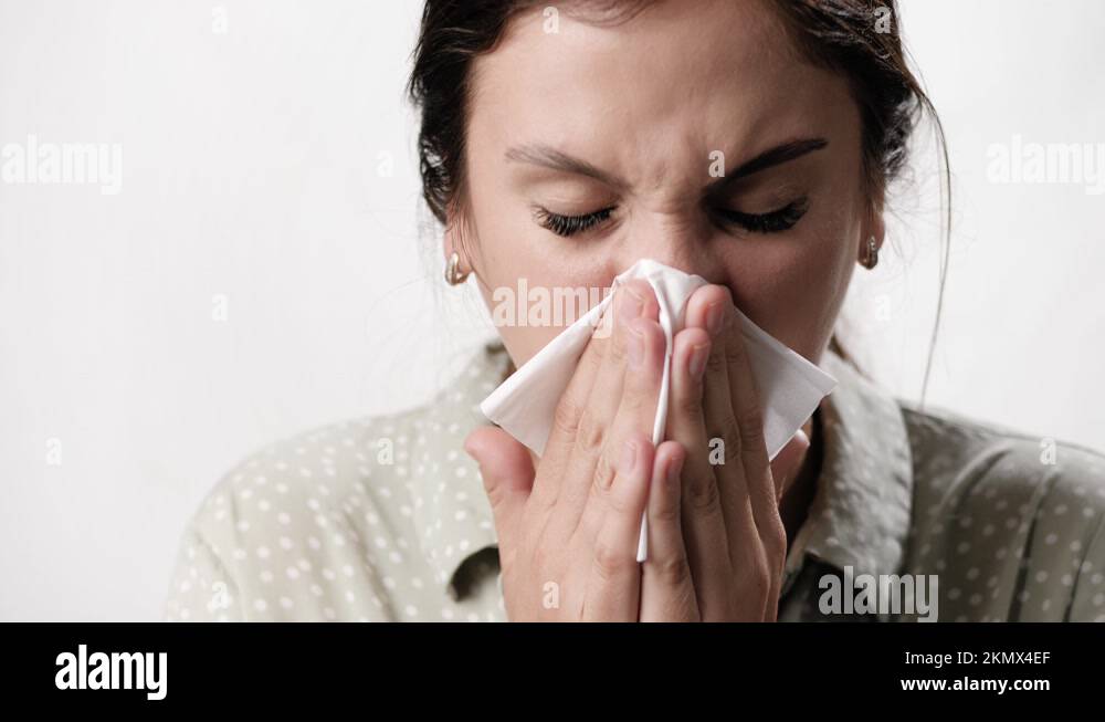 Nasal congestion, runny nose. Woman with cold and flu symptoms on white ...