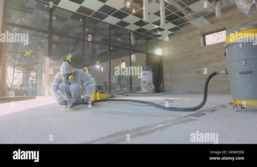 Concrete floor processing process. Builders are making a concrete floor ...