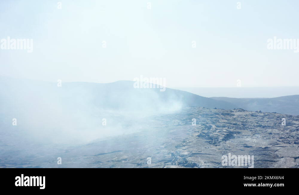 Low flight above new layer of lava after volcanic eruption. Revealing ...