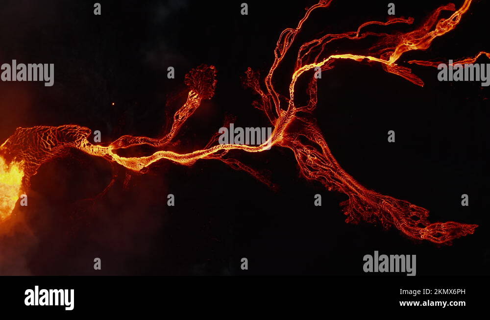 Aerial birds eye overhead top down panning view of flowing hot lava ...