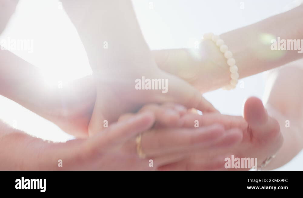 Team holding or putting together hands, happy teamwork, support or help ...