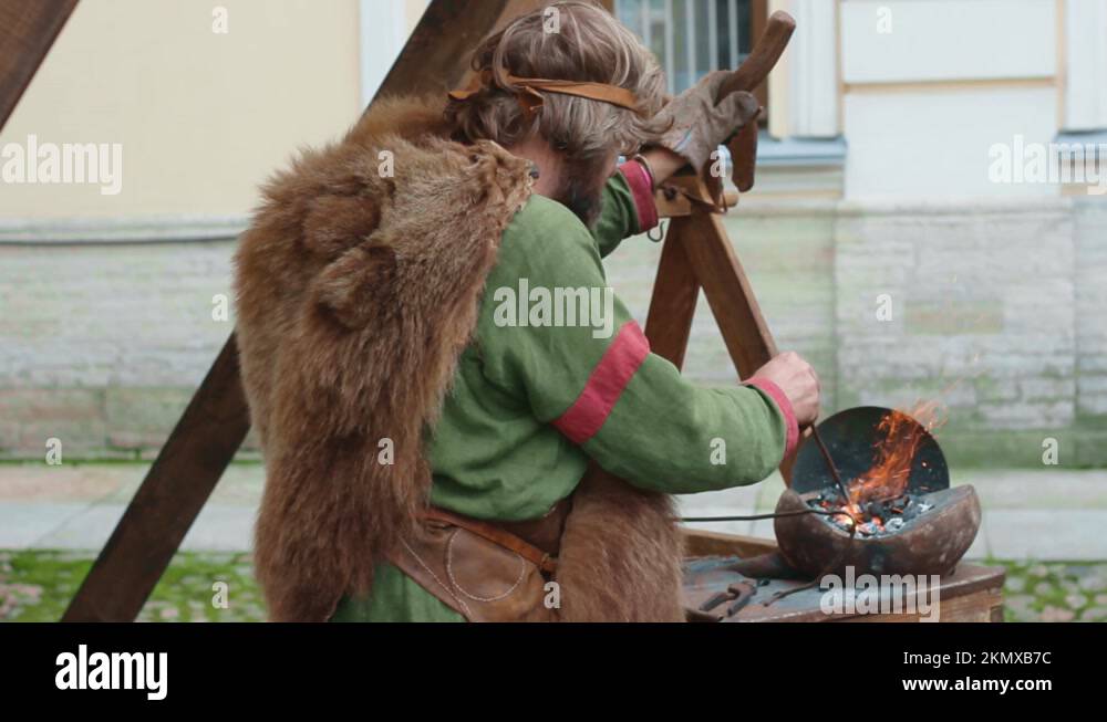 ancient forge and blacksmith sinks the bugle in the manual medieval ...