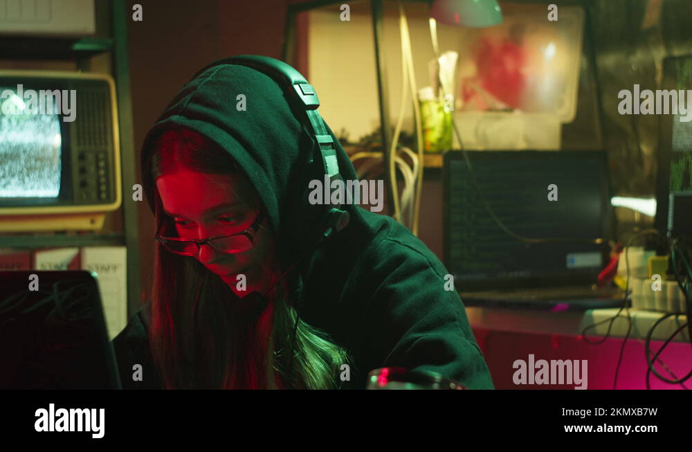 Hacker Typing On Keyboard At Night Breaking Password Wearing Black Hood Stock Video Footage