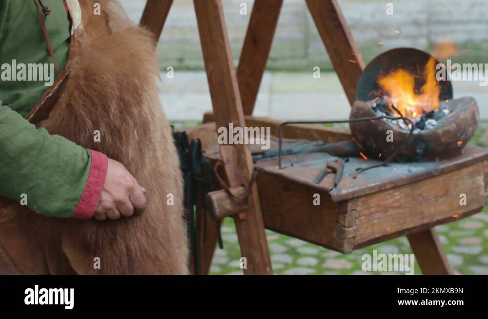 ancient forge and blacksmith sinks the bugle in the manual medieval ...