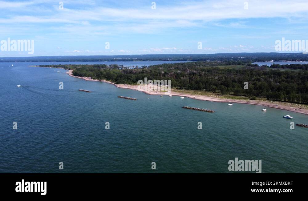Presque Isle State Park is a 3,200-acre sandy peninsula that arches ...