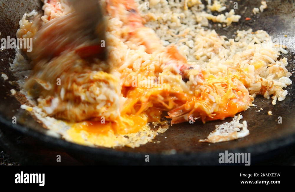 Frying rice with egg and shrimps in pan, Thai famous food Stock Video ...