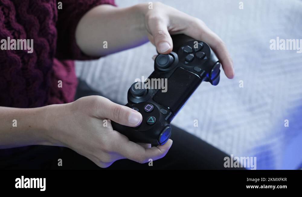 Video game wireless controller joystick. Hands pressing buttons on ...