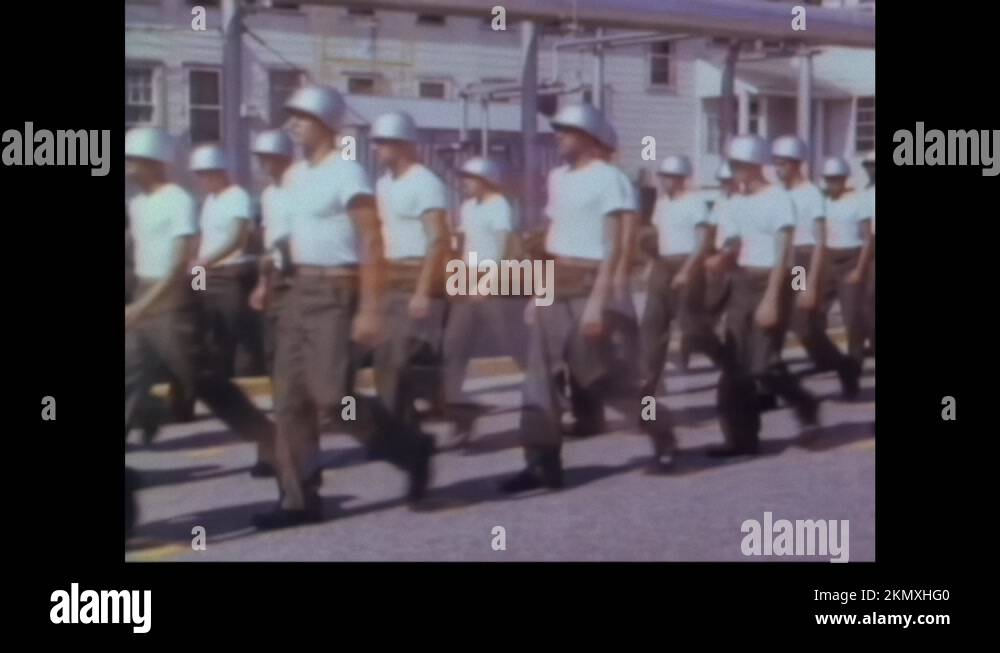 1960s: Drill sergeant and recruits walk past barracks. Officer changes ...