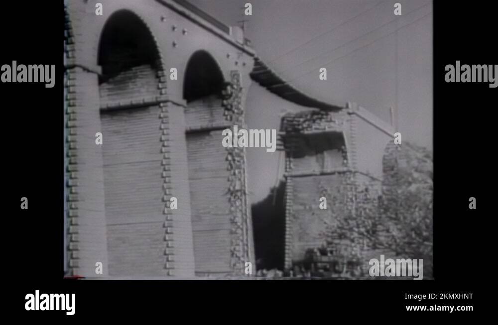 1940s: Destroyed bridge in water. Remains of destroyed bridge ...