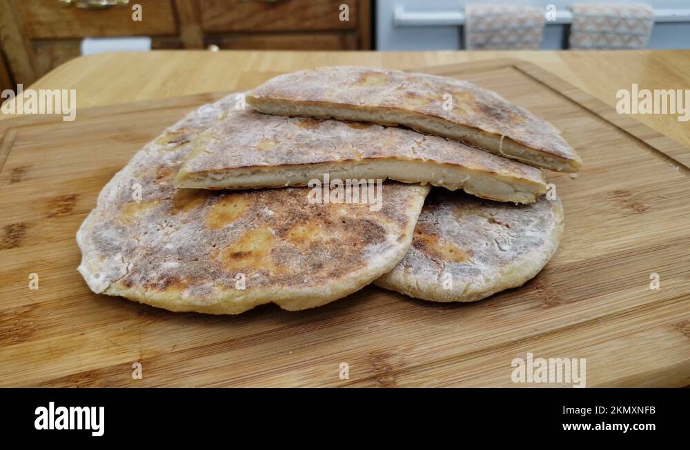 Panning left to right of fresh cooked flat potato bread Stock Video ...