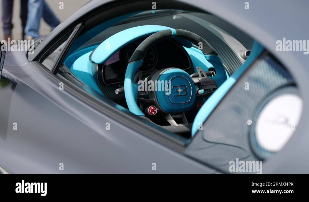Bugatti Chiron hypercar dash and steering wheel. Slow motion shot ...