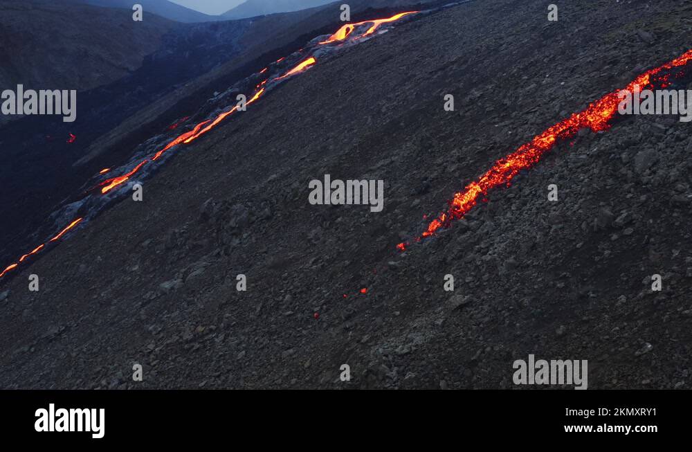 Lava river heads- breaking ground - stationary lava river in background ...