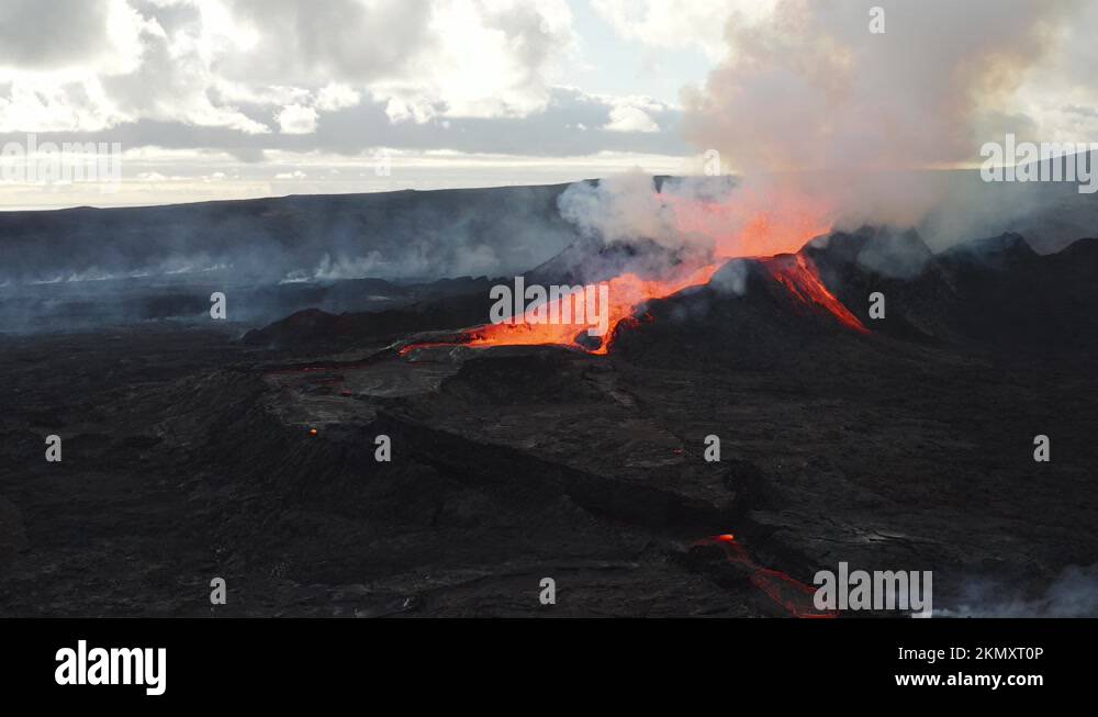 Epic volcano erupting - distance panning part 2 Stock Video Footage - Alamy