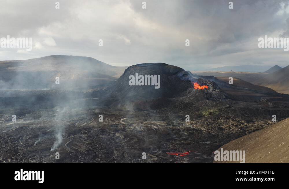 Epic volcano erupting daylight - hill foreground panning Stock Video ...