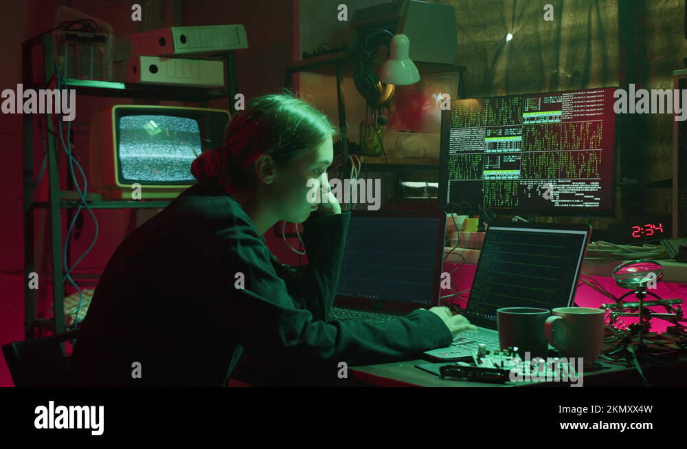 Tired Hacker Typing On Keyboard At Night Breaking Password Using