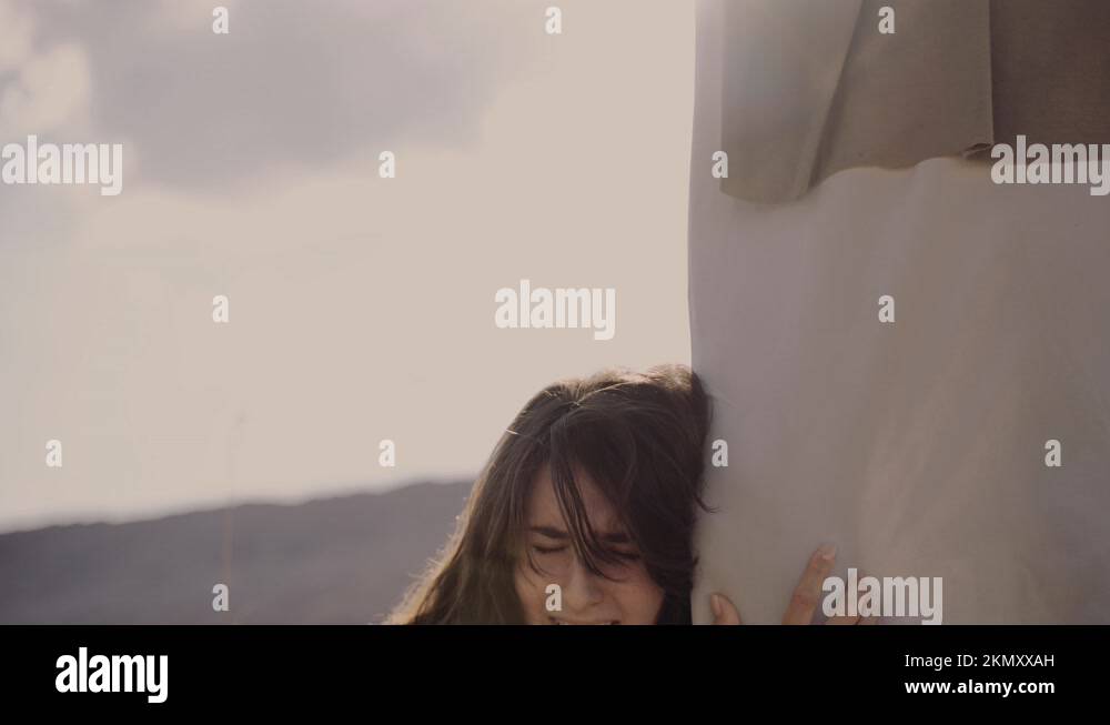 Mary mourns the death of Jesus at his feet. Jesus is crucified on the cross Stock Video Footage ...