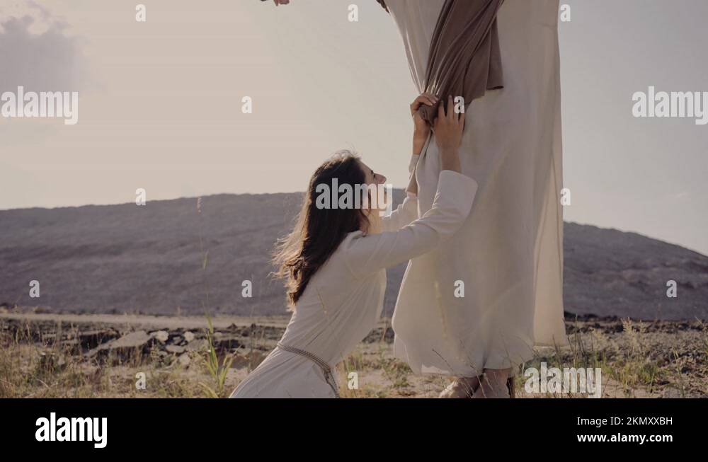 Mary falls at Jesus' feet and mourns his death. Wind is blowing Stock Video Footage - Alamy