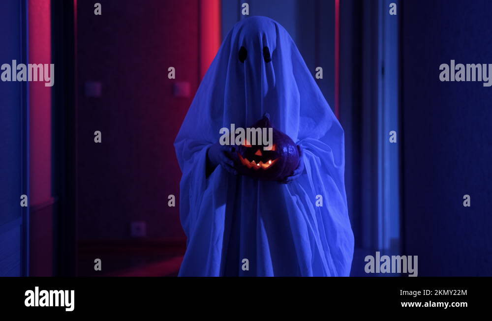Scary ghost with gourd jack at home. Child in halloween carnival ...