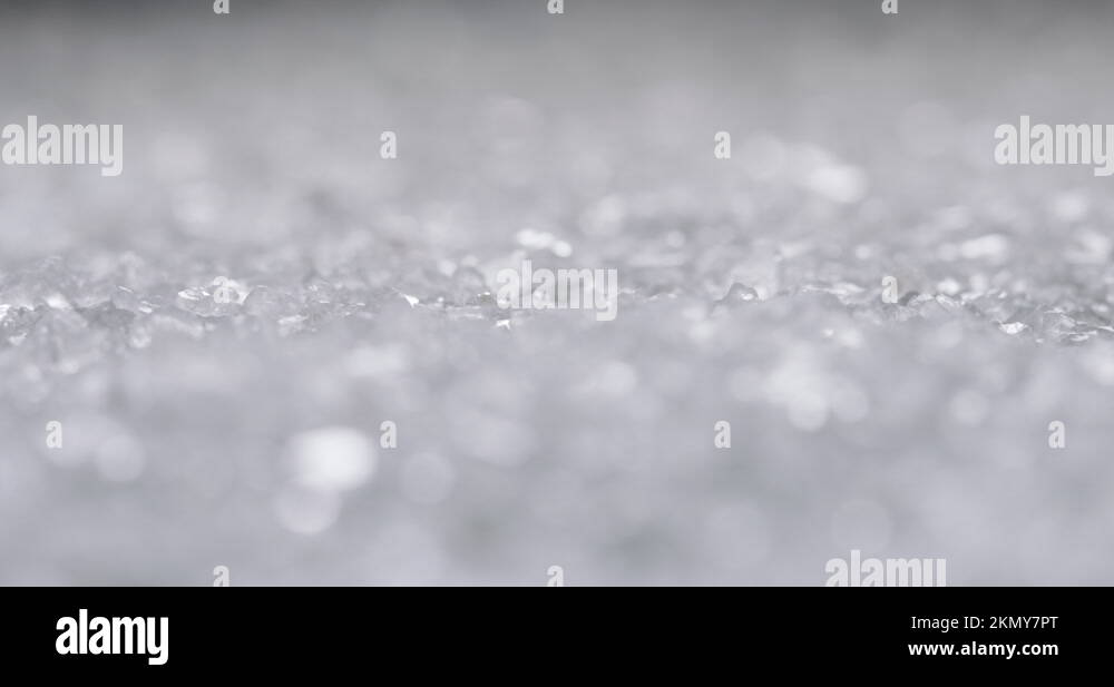 Light glowing and fading on plain white salt crystals. Clear bath ...