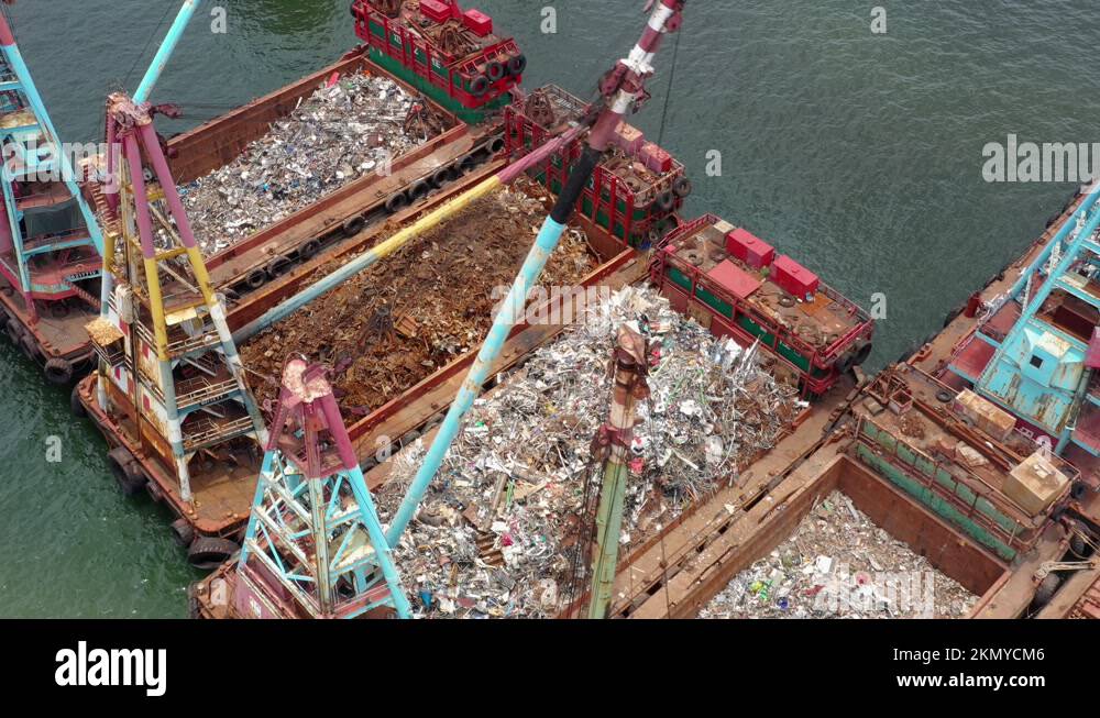Recycling scrap metal plant over crane load a cargo ship vessel Stock ...