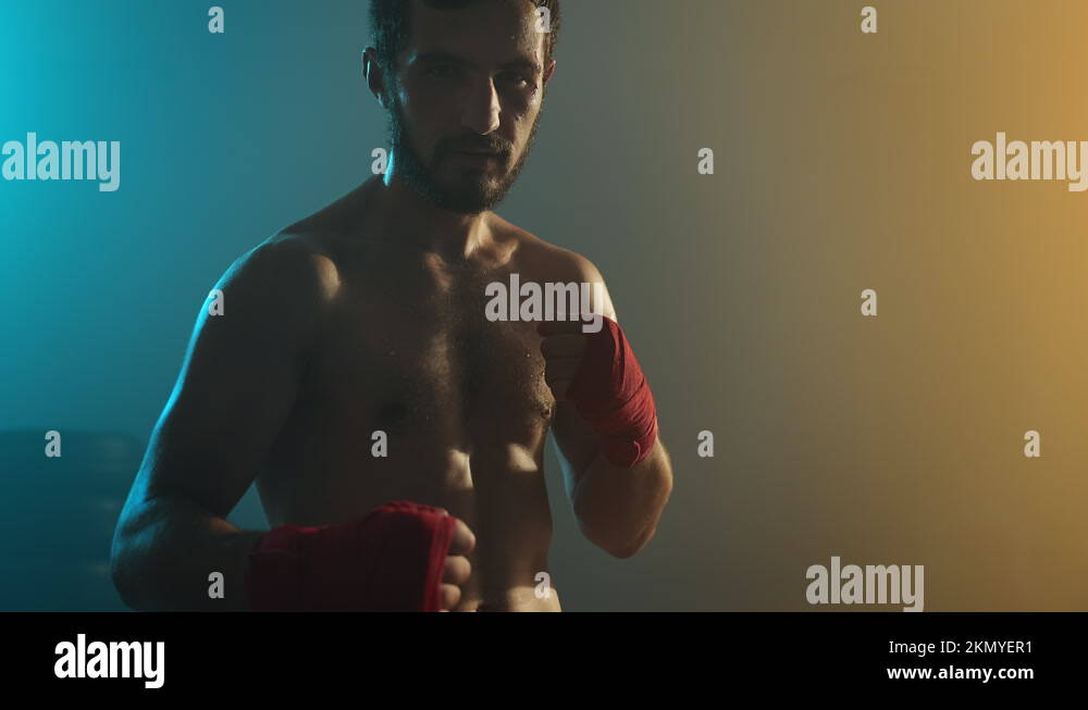 Young Boxer In Training. Handsome Man Looks Straight Into The Camera ...