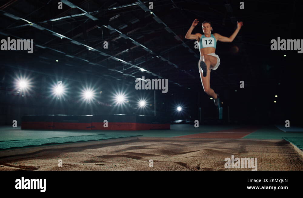Female Doing Long Jump Stock Video Footage - Alamy