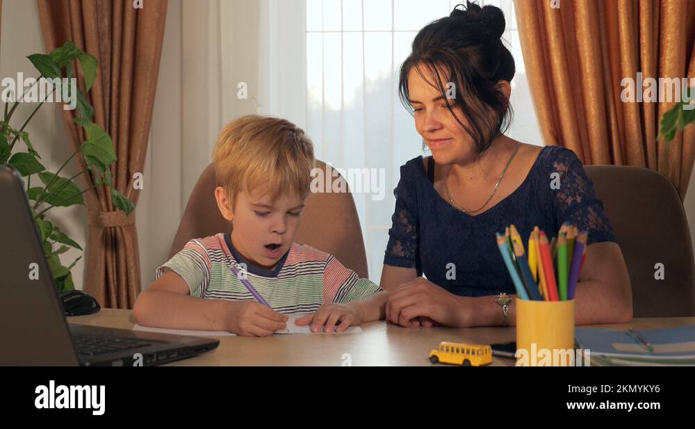 Young Mother Teach Child Help Study Homework Boy Distance Learning at Home 4K Stock Video ...