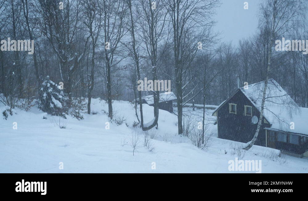 wooden house during hard snowfall 5 Stock Video Footage - Alamy