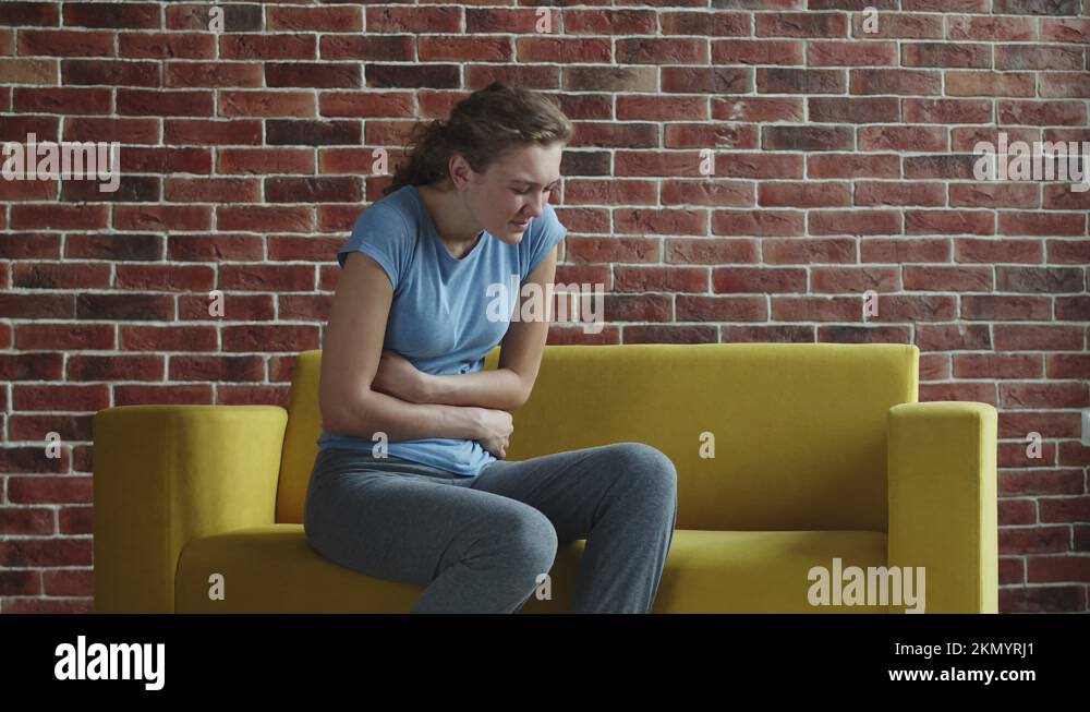 Woman curled up on sofa Stock Videos & Footage - HD and 4K Video Clips ...