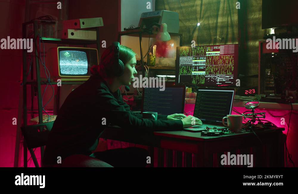 Hacker Typing On Keyboard At Night Breaking Password Using Laptop And