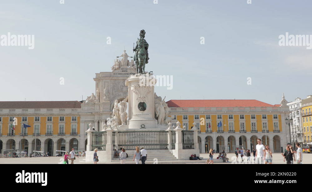People Walking At Terreiro do Paco Passing By Statue Of King Jose I In ...