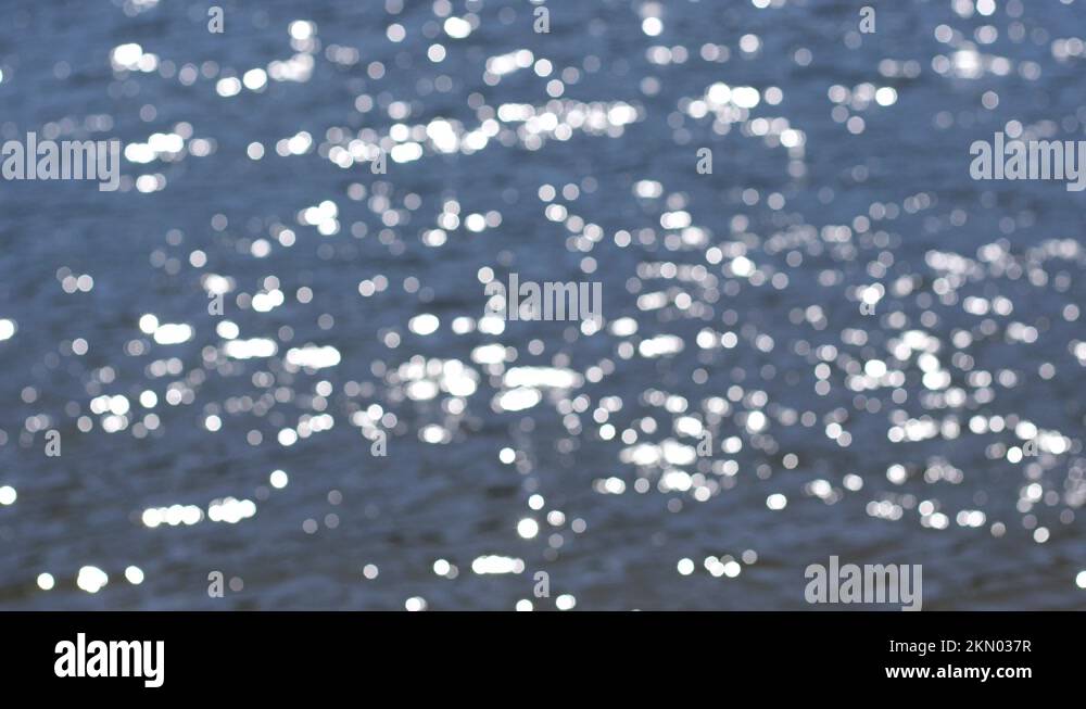 Abstract blurry 4k stock video blue background with soft sparkling sun ...