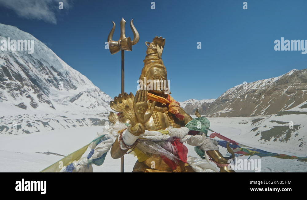 Golden statue of Lord Shiva shine at sun against snowy Himalayas highlands Stock Video Footage ...